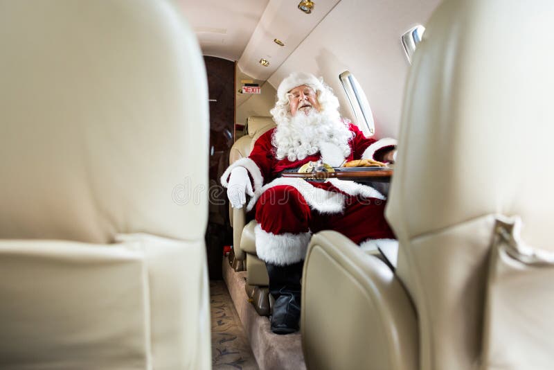 Santa Claus Sleeping in Private Jet Stock Image - Image of claus, milk ...