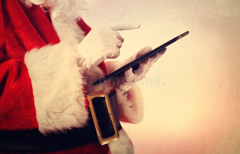 Santa Claus with tablet stock image. Image of present - 60632517