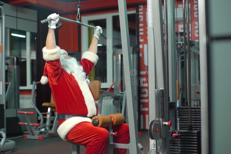 Santa Claus Training at the Gym on Christmas Day. Exercise-machine ...