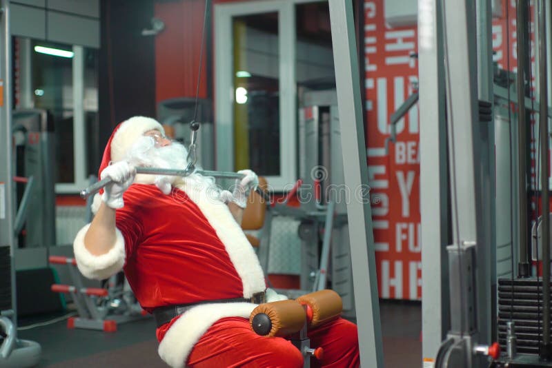 Santa Claus Training at the Gym on Christmas Day. Exercise-machine ...