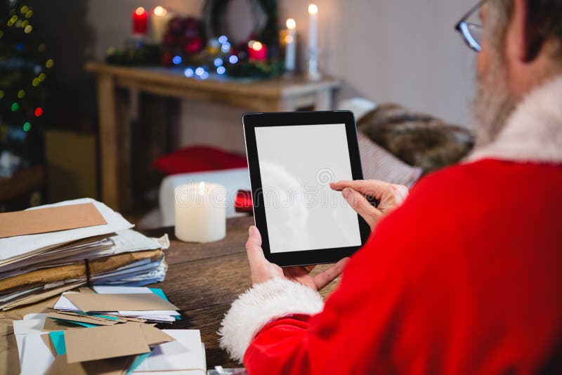 Santa Claus Using Digital Tablet Stock Photo - Image of costume, abode ...