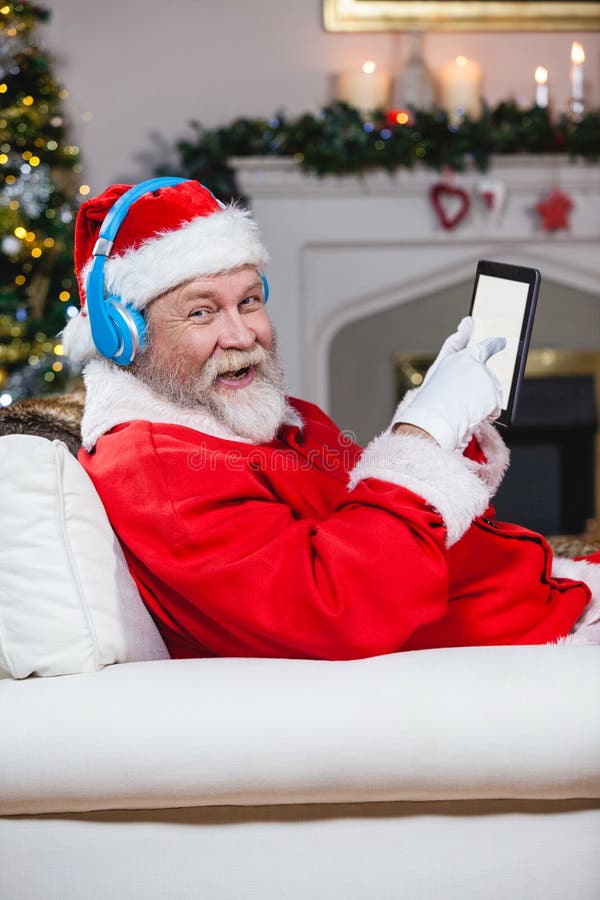 Santa Claus Using Digital Tablet at Home Stock Photo - Image of ...
