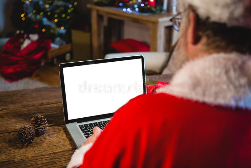Santa Claus using laptop stock photo. Image of communication - 101511268