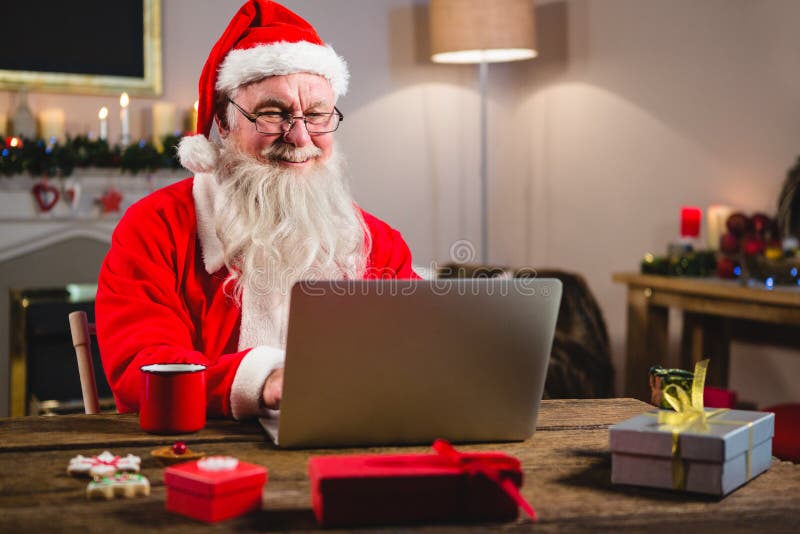 Santa Claus Using Laptop on Table Stock Photo - Image of saint ...