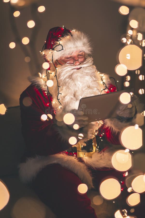 Santa Claus Using a Tablet Computer Stock Photo - Image of costume ...