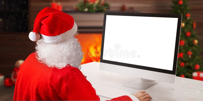 Santa Claus Work on Computer beside Fireplace and Christmas Tree Stock ...