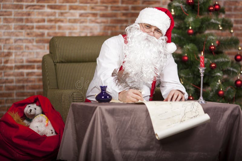 Santa Claus Checks His List Stock Image - Image of glove, holiday: 31371243