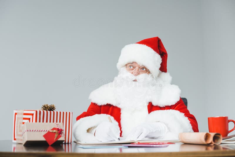 Santa Claus Writing at Table Stock Photo - Image of santa ...