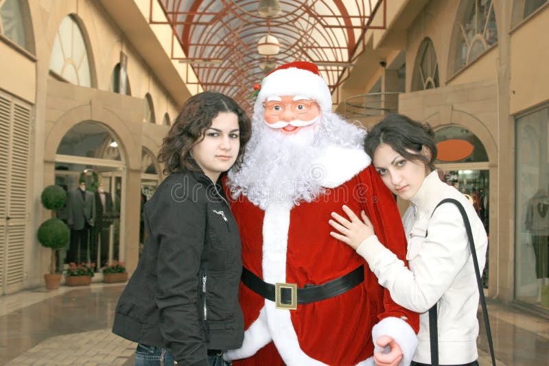 Santa Clause and girls stock image. Image of nose, brunette - 6873671