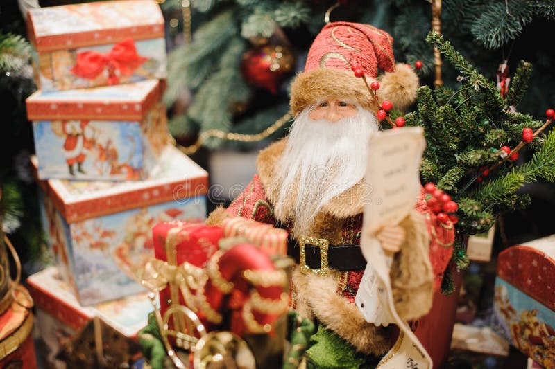 Santa Claws Statue on Background of Green Pine Branch Stock Image ...