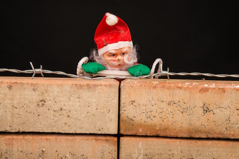 Santa climbing the wall stock photo. Image of holiday - 123060092