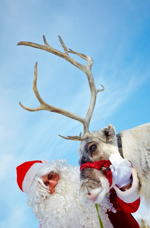 Santa with deer stock image. Image of winter, xmas, animal - 63144759