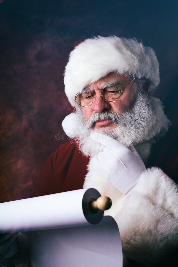 Santa: Disappointed Santa Going through the Naughty and Nice List Stock ...
