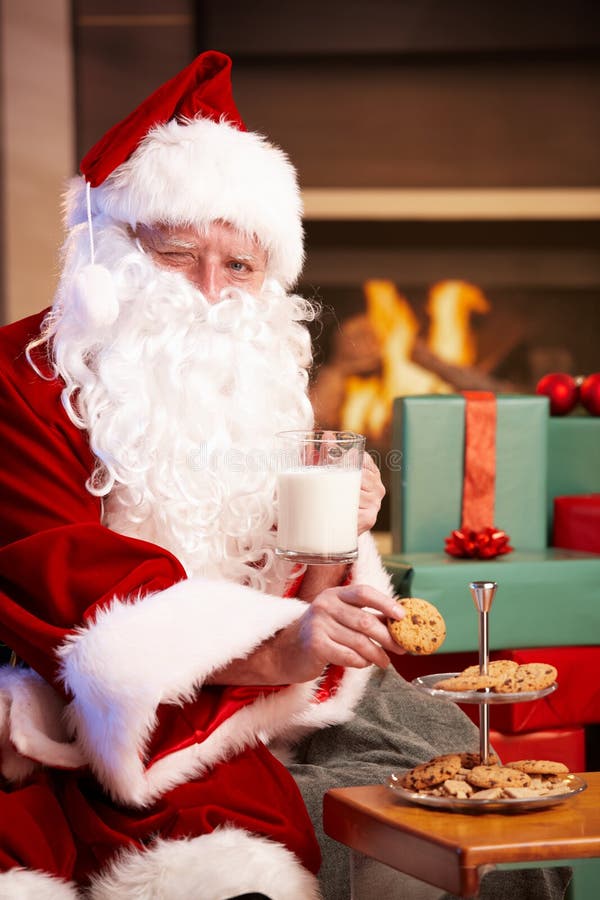 Santa Drinking Milk Eating Chocolate Chip Cookies Stock Photo - Image ...