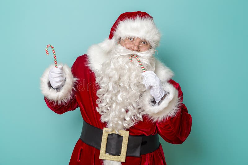 Santa eating candy cane stock image. Image of bearded - 202273803