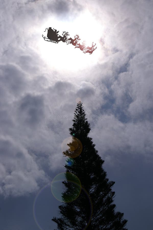 Santa Flying through the Sky Stock Photo - Image of festive, culture ...