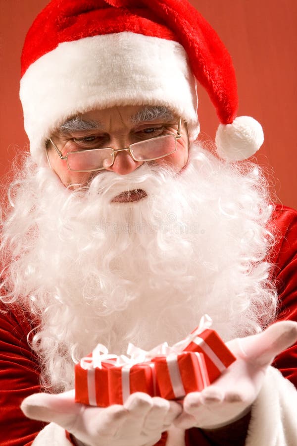 Santa with gifts stock photo. Image of eyeglasses, holiday - 12084946