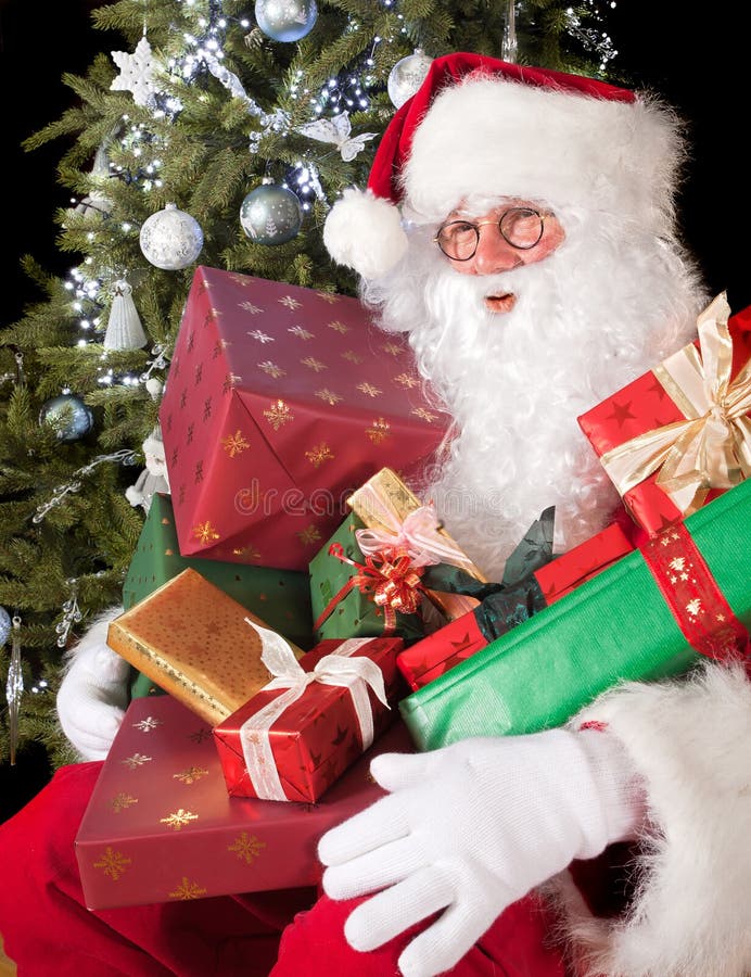 Santa with presents stock photo. Image of seasonal, sitting - 21594044