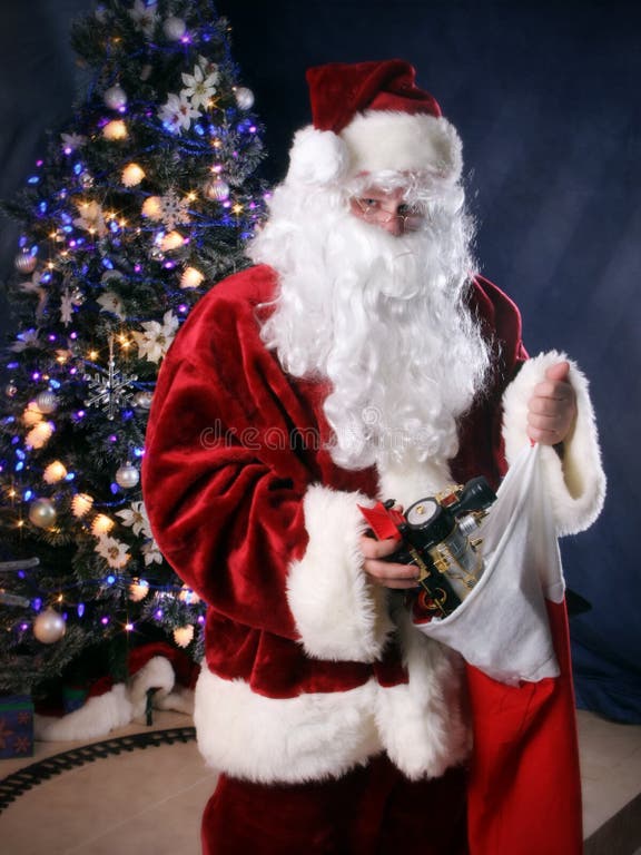Santa Giving stock image. Image of lights, costume, glow - 11854849