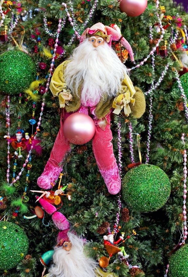 Santa Hanging on a Colourful Decorated Christmas Tree Stock Photo ...