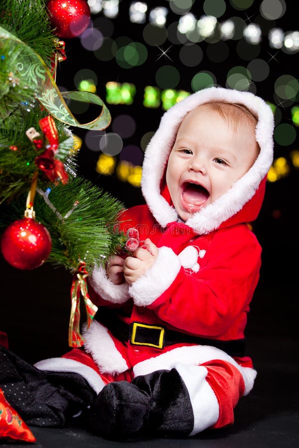 Santa Helper Decorating Christmas Tree Stock Image - Image of child ...