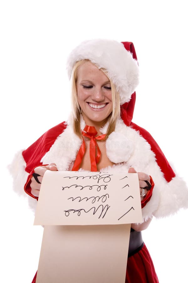SAnta Helper Looking at List Smiling Stock Image - Image of female ...