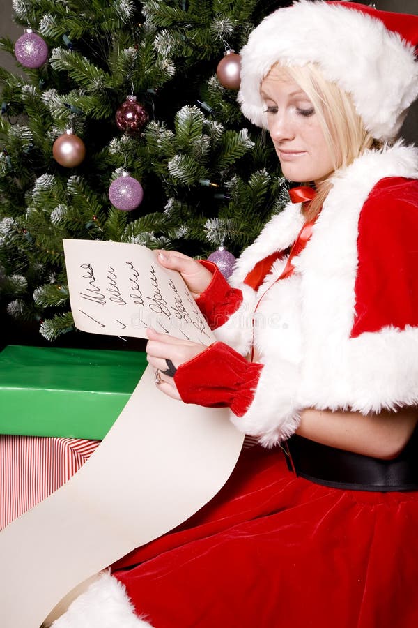 Santa Helper by Tree with List Stock Photo - Image of holiday, dress ...