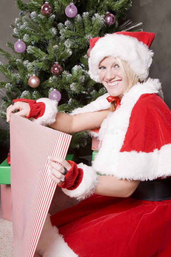 Santa Helper Wrapping Gifts Stock Image - Image of december, hand: 11940197