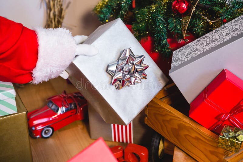 Santa Keeping a Gift on the Wooden Trolley Stock Image - Image of ...