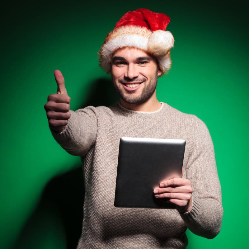 Santa Man Making Ok Gesture while Reading on Tablet Stock Photo - Image ...