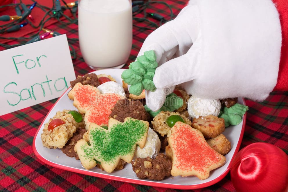Santa Picking Out a Cookie stock image. Image of assortment - 10890151