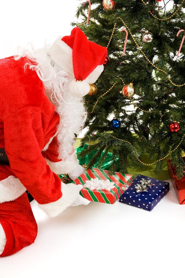 Santa Puts Gifts Under the Tree Stock Photo - Image of morning, tree ...