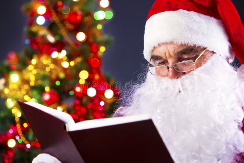 Santa reading a book stock photo. Image of eyeglasses - 17230002