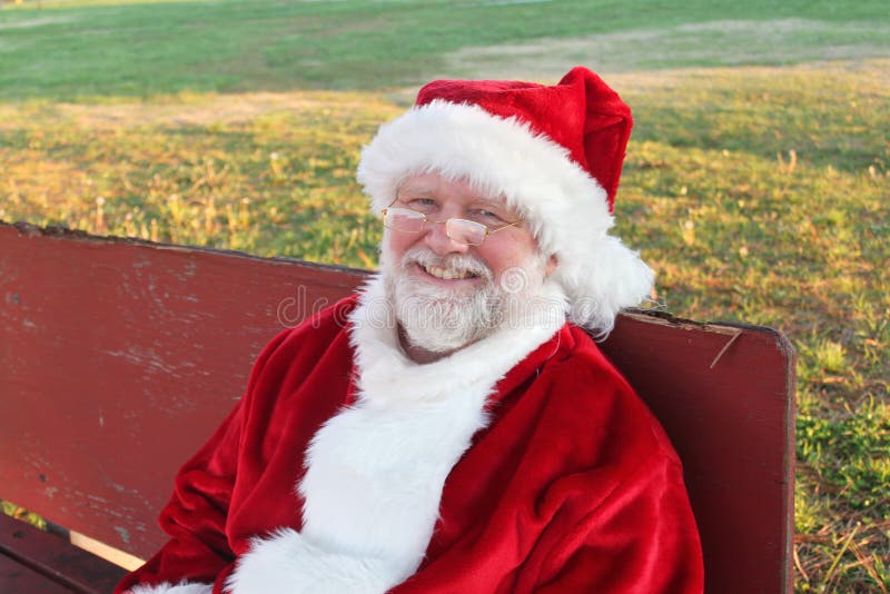 Santa Relaxing on a Bench stock image. Image of happy - 22255581