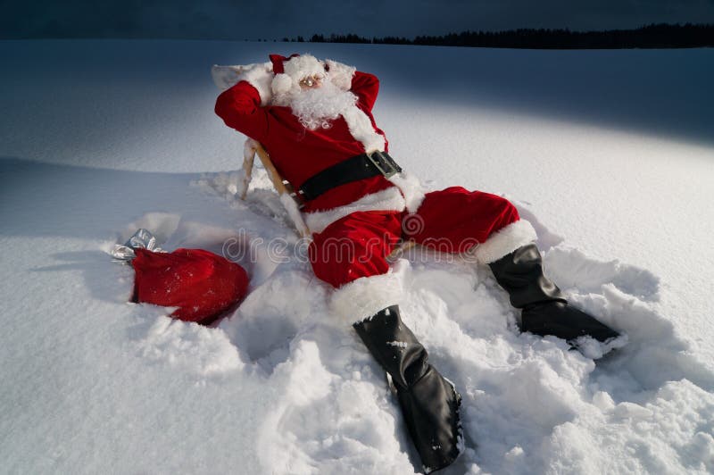 Santa relaxing on a sunbed stock image. Image of celebration - 22329381