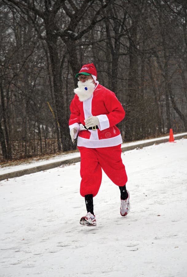 Santa Running in the Snow editorial image. Image of athlete - 4188395