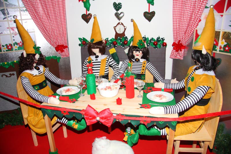 The Santa`s Elves are at the Dinner Table Stock Photo - Image of ...