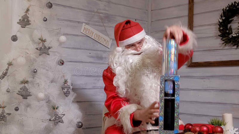 Santa Shows Trick with a Pipe Stock Photo - Image of cheerful, party ...