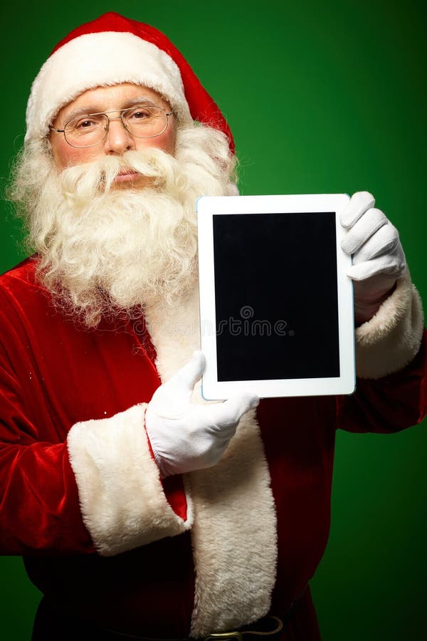 Santa with touchscreen stock photo. Image of tradition - 63448240