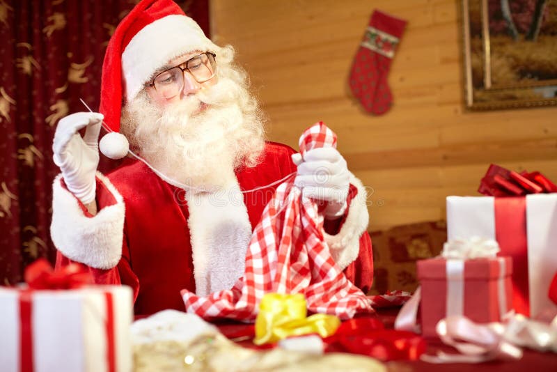 Santa working stock image. Image of christmas, grey, costume - 76976333