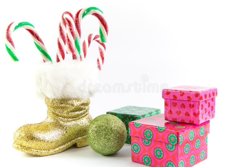 Santas Golden Boot with Gift Boxes and Ornaments Stock Photo - Image of ...