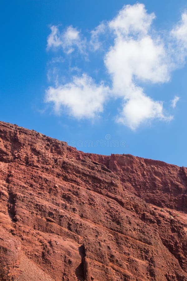 Santorini - Red Pumice Layers and Sky. Stock Image - Image of ...