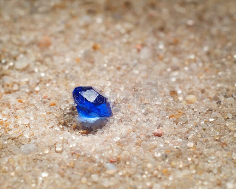 Sapphire Crystal in the Sand Stock Photo - Image of ruby, natural ...