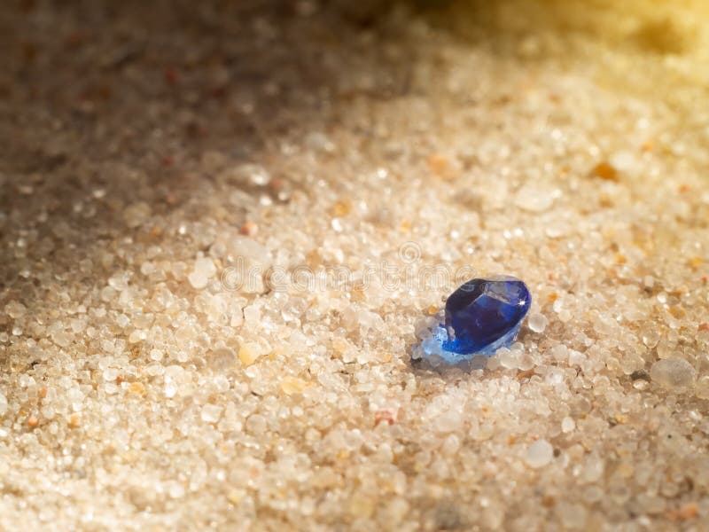Sapphire Crystal in the Sand Stock Image - Image of blue, sapphire ...