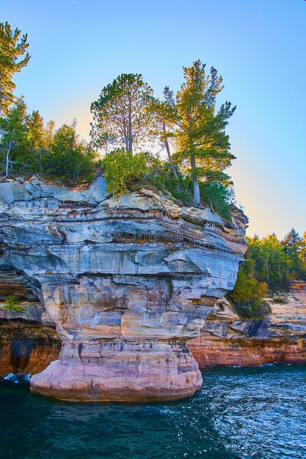 Sapphire Lake Water with Red and White Pictured Rocks Cliff and Sunset ...