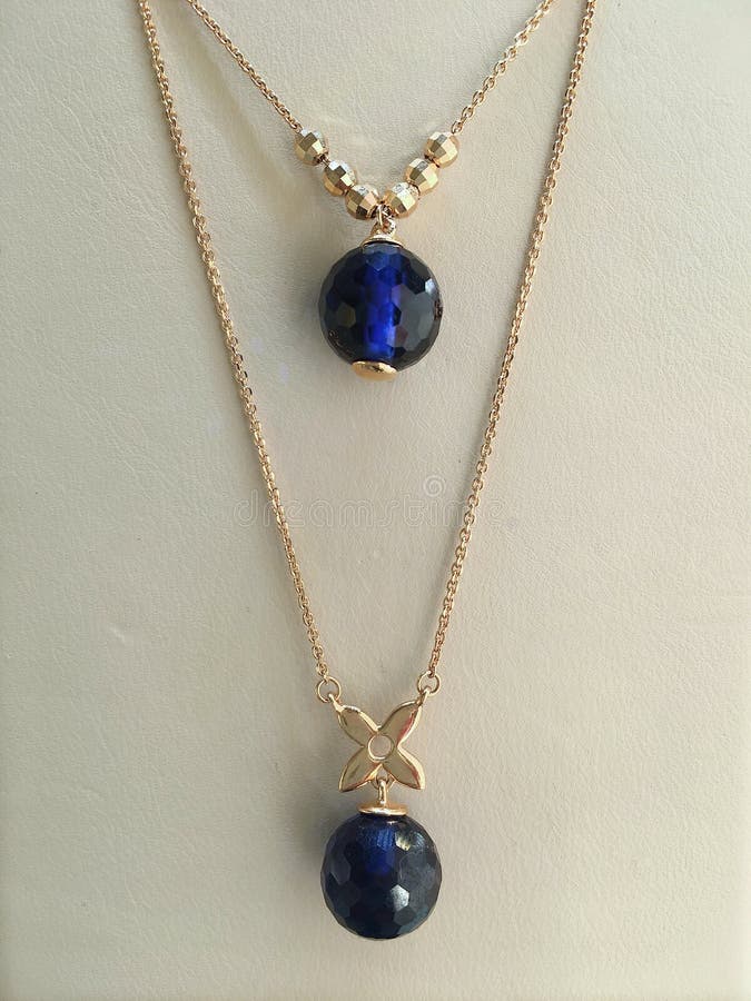 Sapphire Pendants on Gold Chains in a Jewelry Store Window Stock Image ...