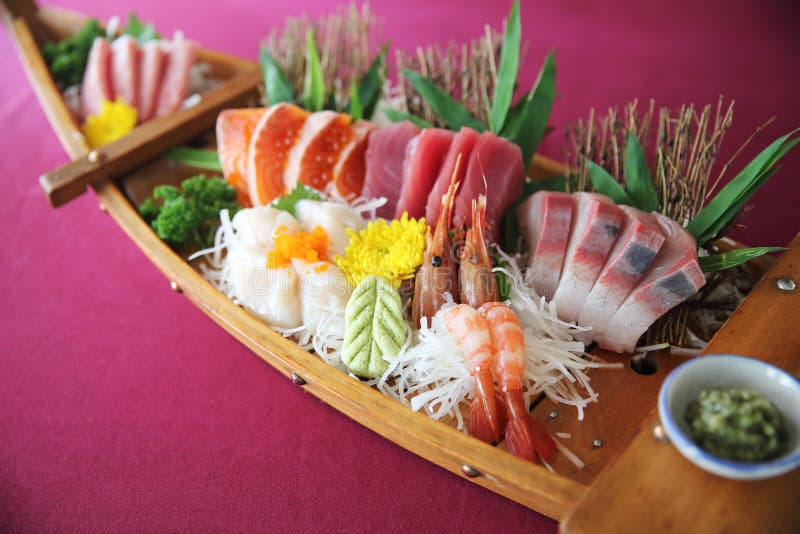 Sashimi set on wooden boat stock image. Image of seafood - 136961503