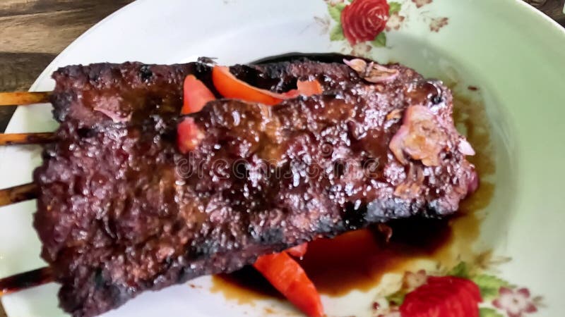 Satay Sapi (beef Skewered). Served with Soy Sauce, Chili and Tomato ...