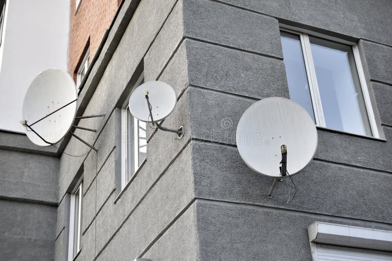 Satellite Dish on a Gray Building Close-up. a Parabolic Antenna on the ...