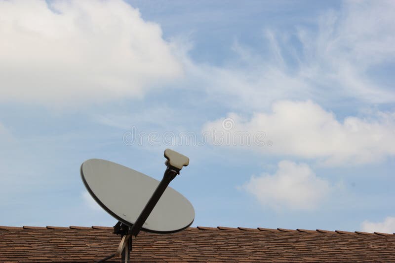 Satellite Dish on the Roof stock photo. Image of cable - 45835600